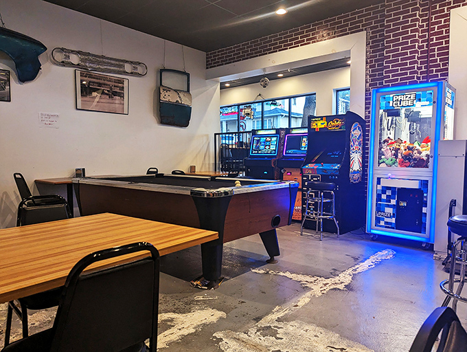 Pool table, arcade games, and pizza—the holy trinity of neighborhood hangouts. This is where memories are made between bites.