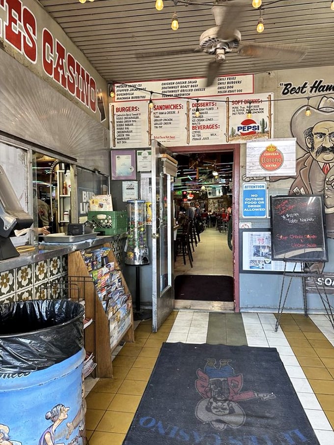 The entrance corridor feels like a time portal – vintage menu boards and nostalgic décor setting the stage for the sensory explosion waiting inside.