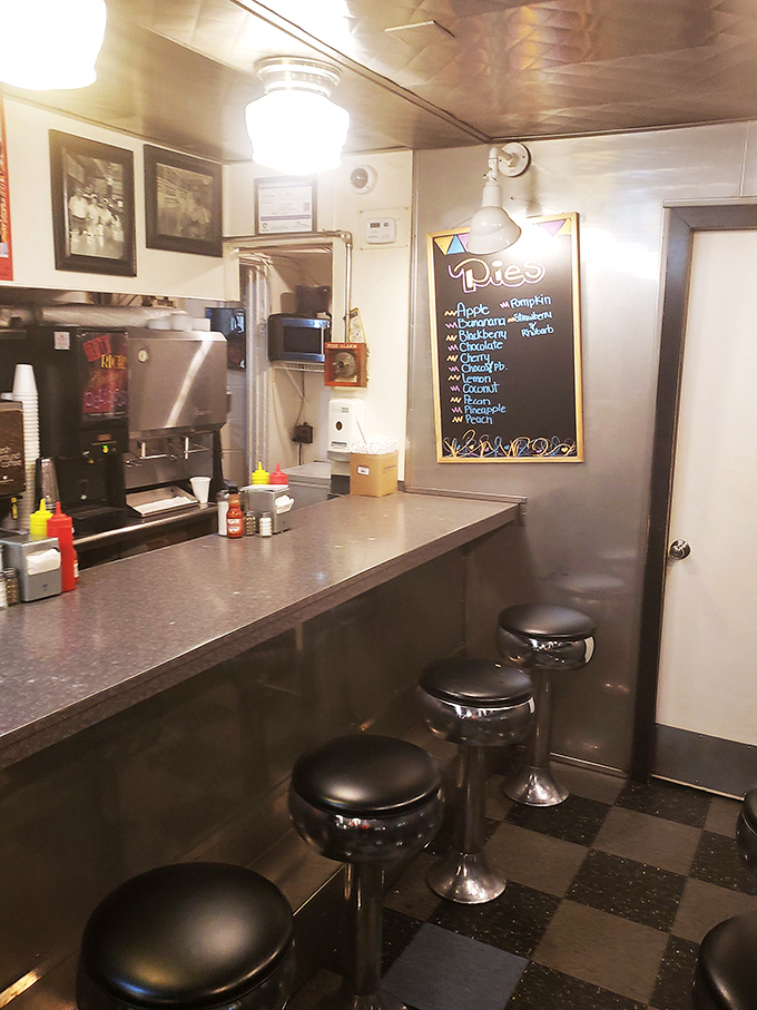 The counter view—where magic happens. That pie board in the background is the grown-up version of a toy store window.