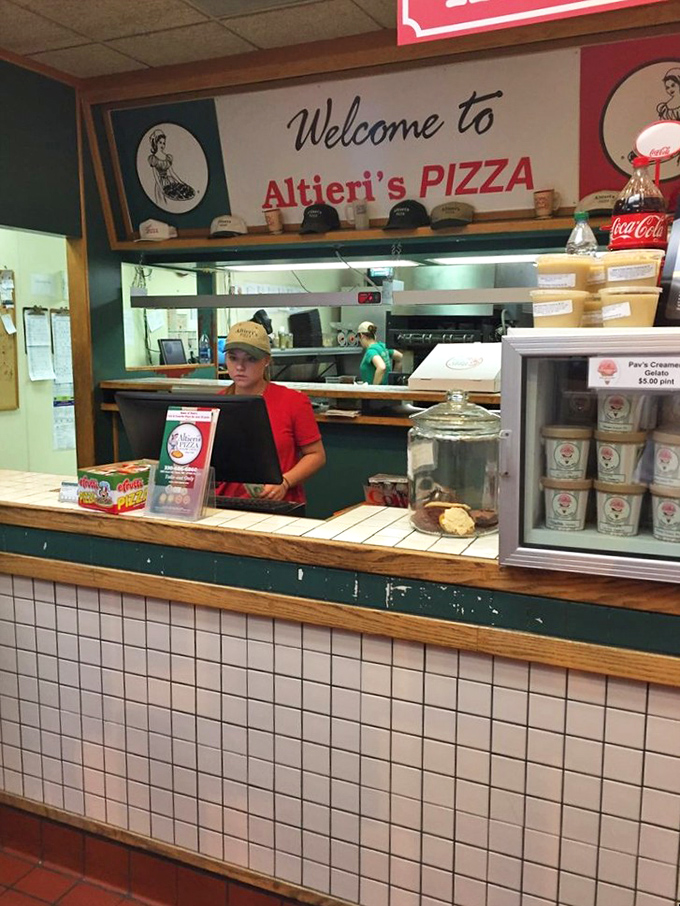 "Welcome to Altieri's Pizza" – three words that promise more happiness than most five-star restaurants could ever deliver.