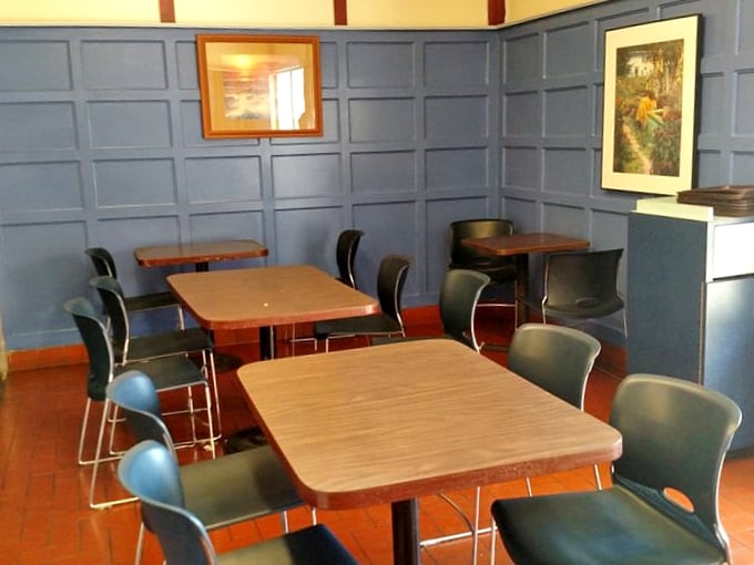 The dining room feels like stepping into a cozy British pub that's been transported to the Valley. Blue walls, simple tables, zero pretension.