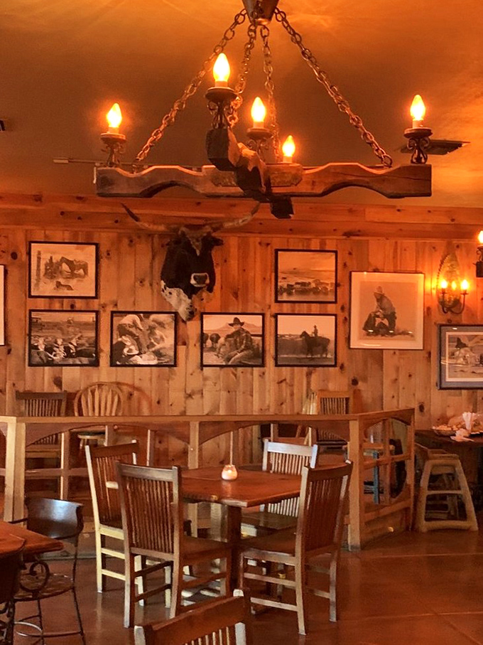 Rustic chandeliers cast a warm glow over wooden tables where countless happy diners have experienced steak nirvana over the decades.
