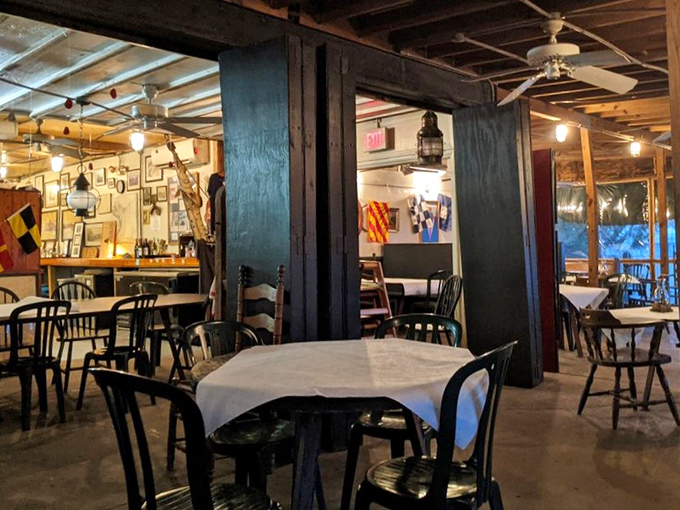 The dining room feels like the galley of a beloved old ship—wooden beams, simple tables, and the promise of maritime feasting.