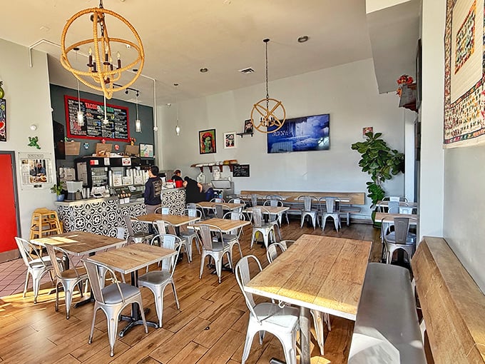 The dining room feels like Mexico City meets San Francisco hipster haven—spacious yet intimate, with those distinctive pendant lights casting a warm glow.