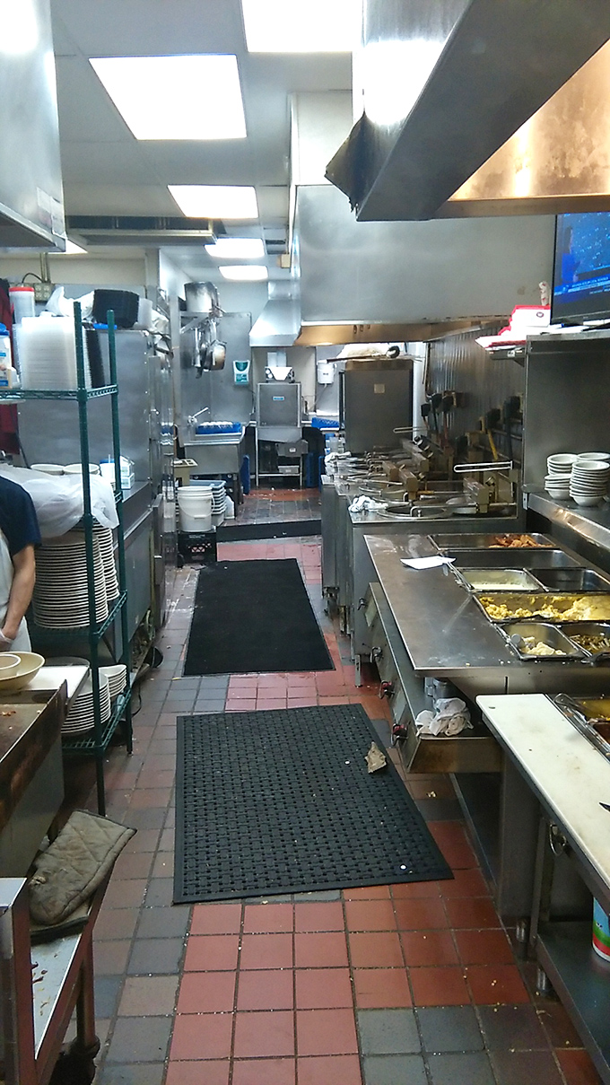The kitchen—where the magic happens. Spotless stainless steel and organized chaos producing plate after plate of homestyle perfection.