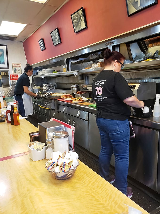 The open kitchen offers dinner and a show—skilled cooks orchestrating breakfast symphonies on a well-seasoned grill that's seen decades of service.
