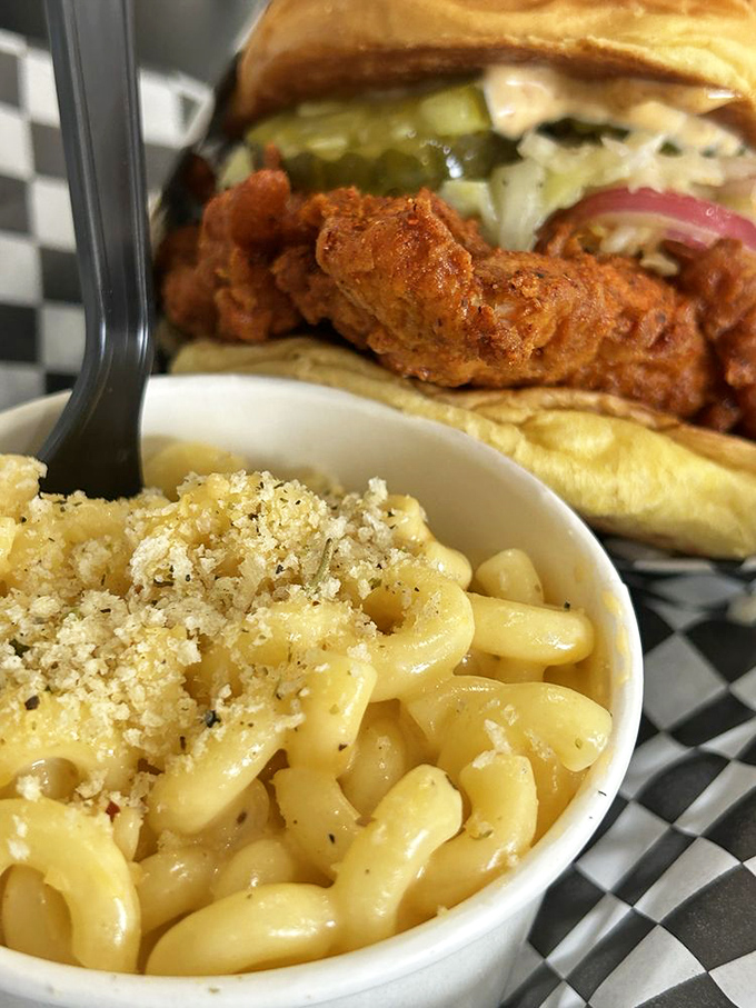 Mac and cheese with a breadcrumb crown—the comfort food diplomat that negotiates peace between your taste buds and Nashville heat.