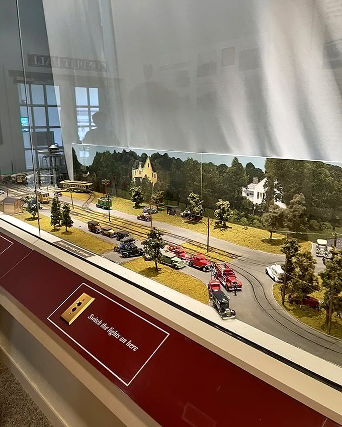 A charming miniature streetscape shows how trolleys once dominated American roads. Look closely—every tiny automobile tells part of the story!