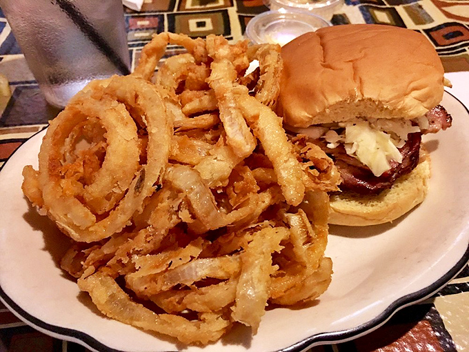 Onion rings and pork sandwich creating the kind of duo that makes you forget about counting calories.