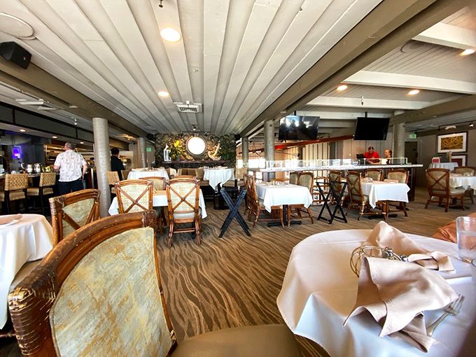 White tablecloths, rattan chairs, and ocean views—this isn't just a dining room, it's California coastal elegance personified.