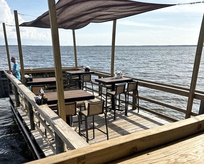 Where every seat comes with a side of serenity. The outdoor dining area invites lingering conversations as boats drift by on Lake Weir's gentle waters.