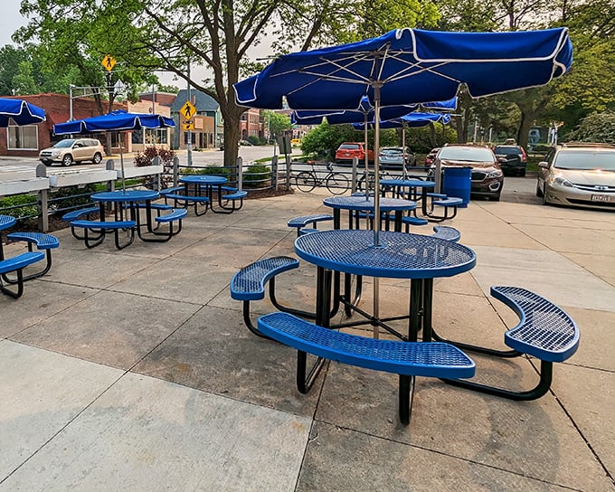 Outdoor seating where summer memories are made. Those blue tables have hosted everything from first-date jitters to post-farmers-market victory meals.