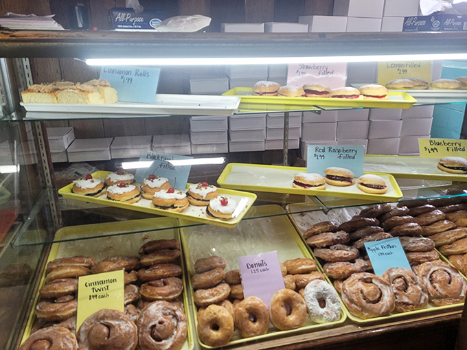 The pastry case – where indecision becomes an art form and "I'll take one of each" becomes a perfectly reasonable request.