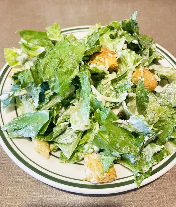 A Caesar salad that actually makes you excited about eating greens. Those house-made croutons aren't just bread with attitude—they're the crown jewels of this leafy kingdom.