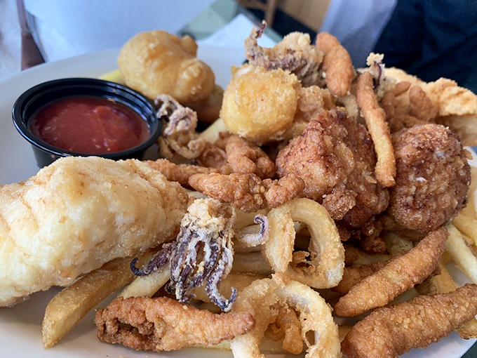 A crispy carnival of fried seafood goodness. This platter doesn't just feed your hunger—it throws a party for your taste buds.