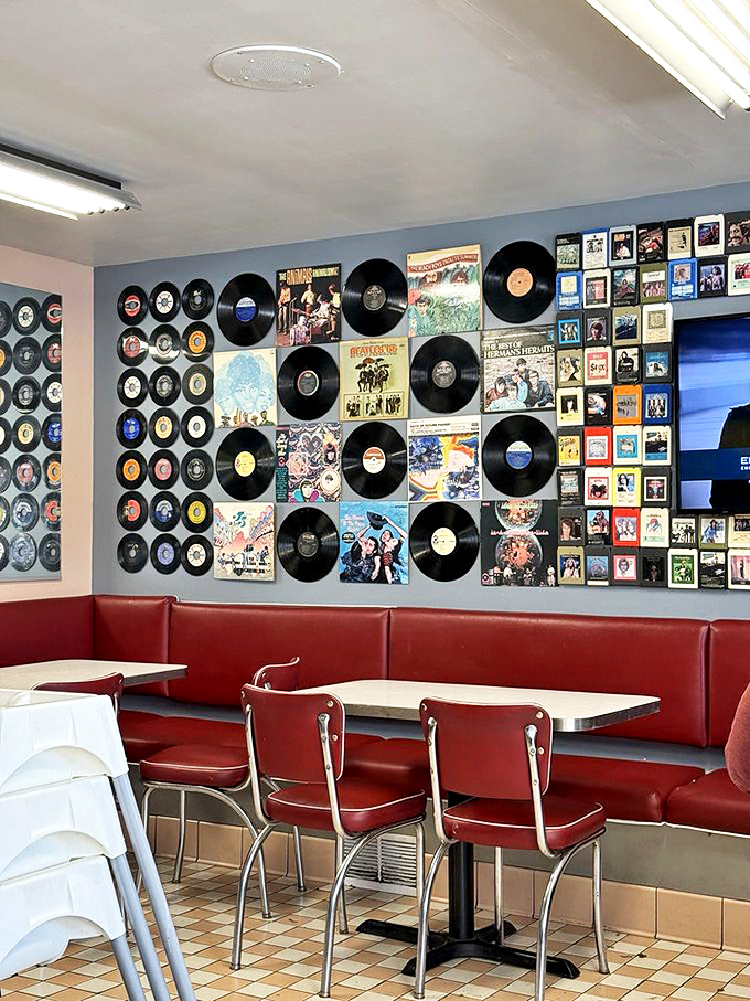The vinyl record wall isn't just decoration—it's a conversation starter that turns "What'll you have?" into "Remember when music came in these?"