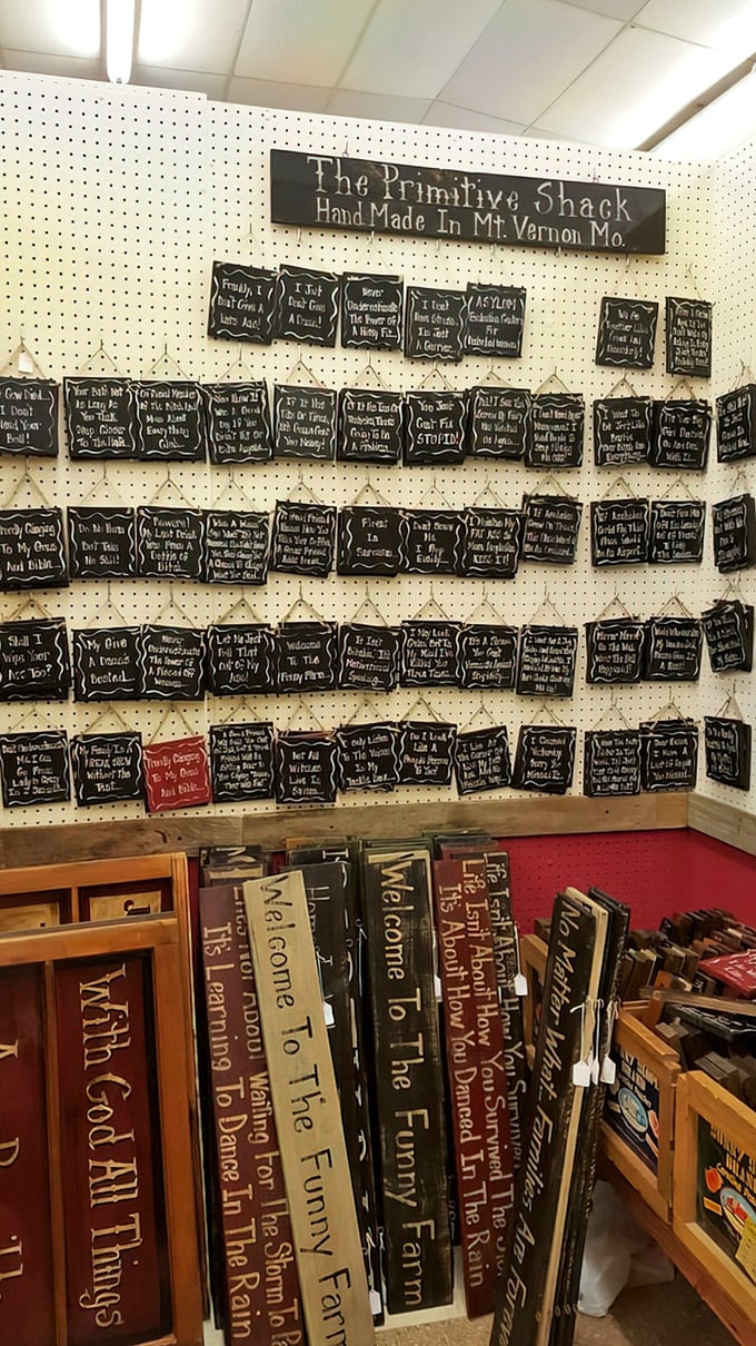 The Primitive Shack's wall of wisdom and whimsy. Like Pinterest boards before the internet, handcrafted with genuine Ozark charm.