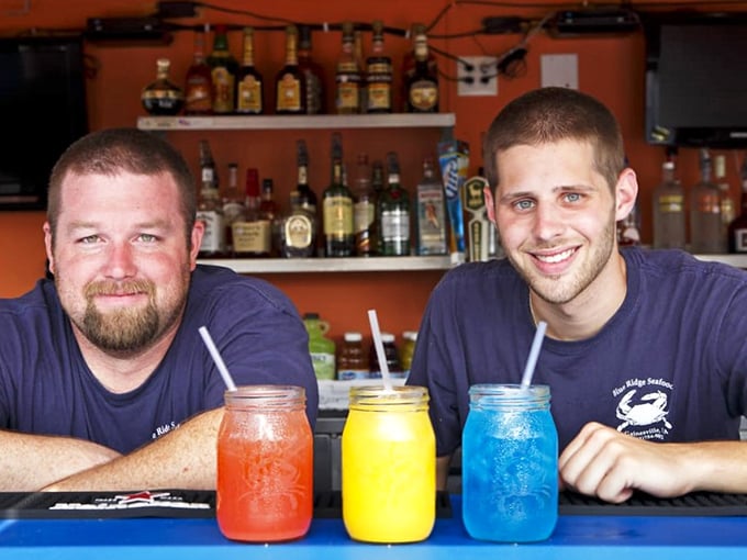 The colorful mason jar drinks aren't just beverages—they're summer in a glass, lined up like a beachside sunset.