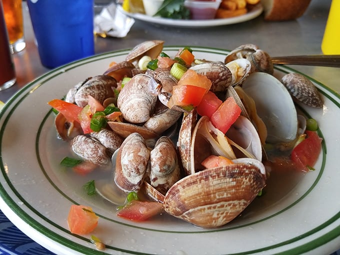 These steamed clams swimming in herb-flecked broth are like a treasure chest from Neptune himself. Each shell opens to reveal a perfect morsel of oceanic bliss.