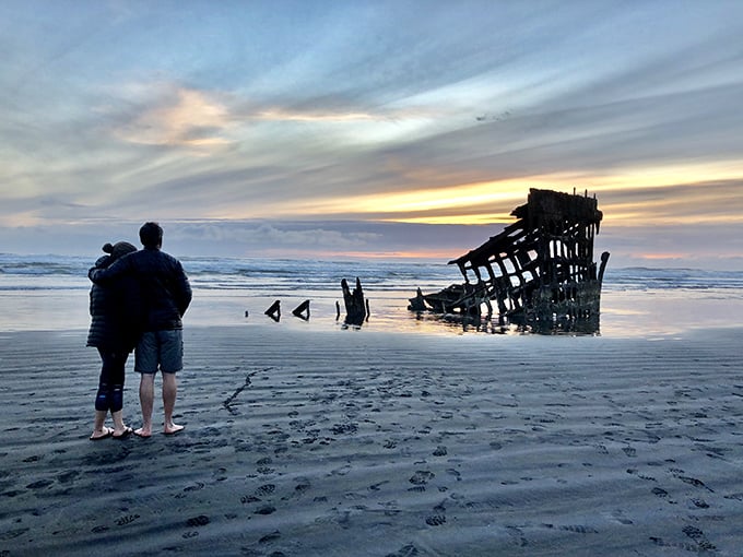 Twilight transforms the Peter Iredale into a brooding silhouette—part ghost ship, part photographer's dream, all Oregon coastal magic.