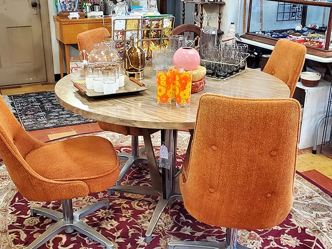 This mid-century dining set isn't just furniture—it's a portal to family dinners circa 1965, complete with orange upholstery that screams "groovy!"