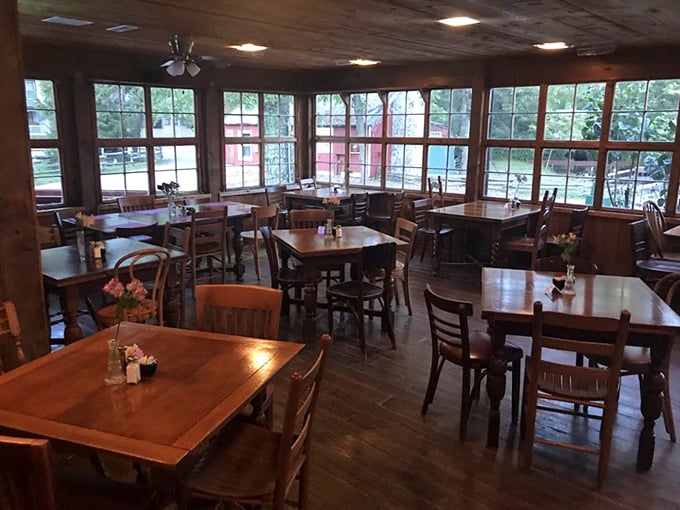 Sun-drenched dining room where windows frame the mill's picturesque surroundings—nature's artwork paired perfectly with your breakfast.