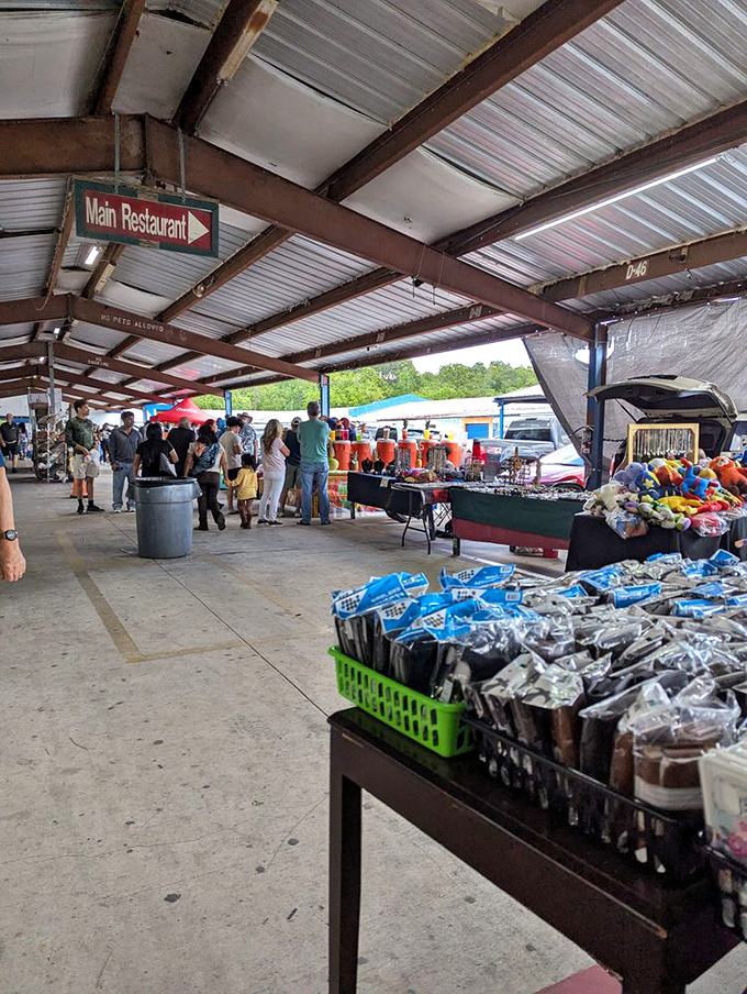 The market's covered walkways buzz with weekend warriors on the hunt. That sign pointing to "Main Restaurant" might be the day's most important discovery.