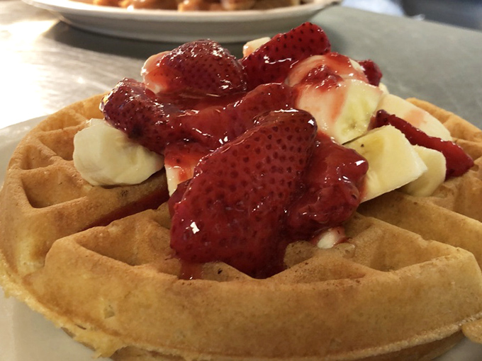 A waffle that's dressed for success with strawberries and bananas. Breakfast or dessert? The beauty is you don't have to choose—it's both.