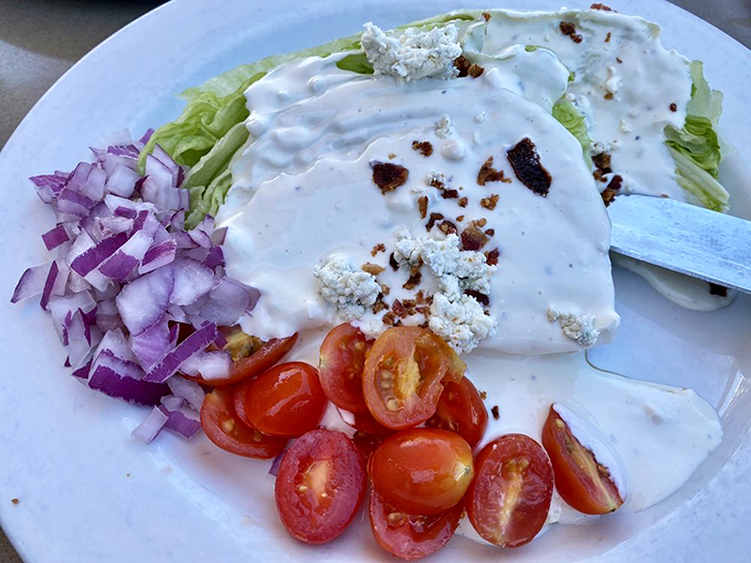 This wedge salad is what iceberg lettuce dreams of becoming when it grows up—draped in dressing with red onion and tomato companions.
