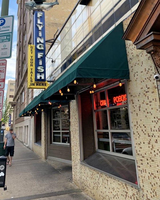 Flying Fish's vintage sign hanging proudly in downtown Memphis promises seafood with personality—just like the singing fish on their walls.