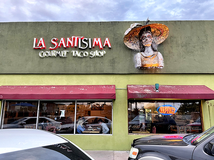 La Santisima's distinctive façade and watchful sculpture guardian invite curious food adventurers into a world of gourmet burrito bliss.