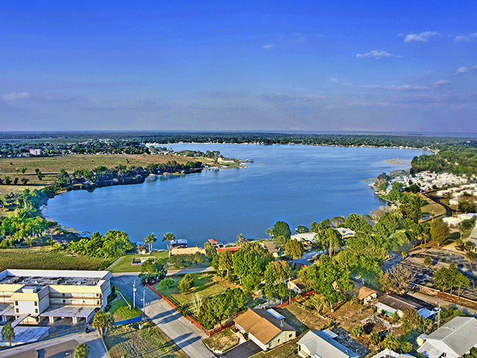 Lake Placid from above – a patchwork of blue water, green fields, and Florida sunshine spread out like nature's quilt.