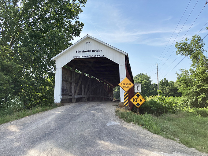 "Cross this bridge at a walk," the sign suggests—good advice for appreciating this red and white covered passage that's been connecting communities since the horse-and-buggy days.