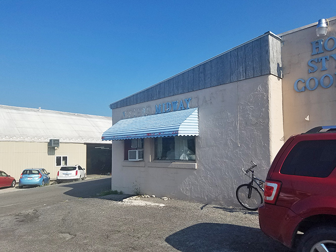 The unassuming exterior of Midway Restaurant in Kenton hides culinary treasures within. Like finding a diamond in a parking lot—complete with blue awning!