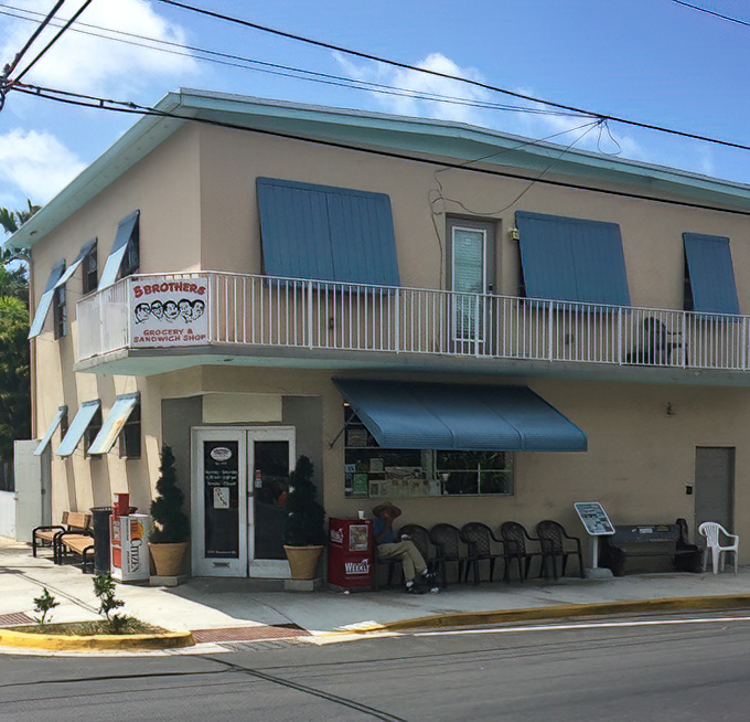 The unassuming beige exterior of 5 Brothers might not scream "culinary landmark," but locals know this modest building houses Cuban sandwich perfection.