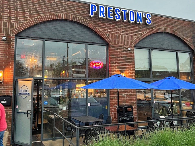 Preston's brick exterior says "no frills" but the glowing blue sign promises something special waiting inside for burger enthusiasts.