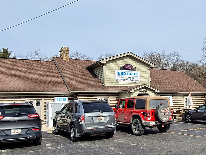 The rustic log cabin exterior isn't just charming—it's a siren call to hungry travelers. That parking lot tells the real story: people come from miles around.