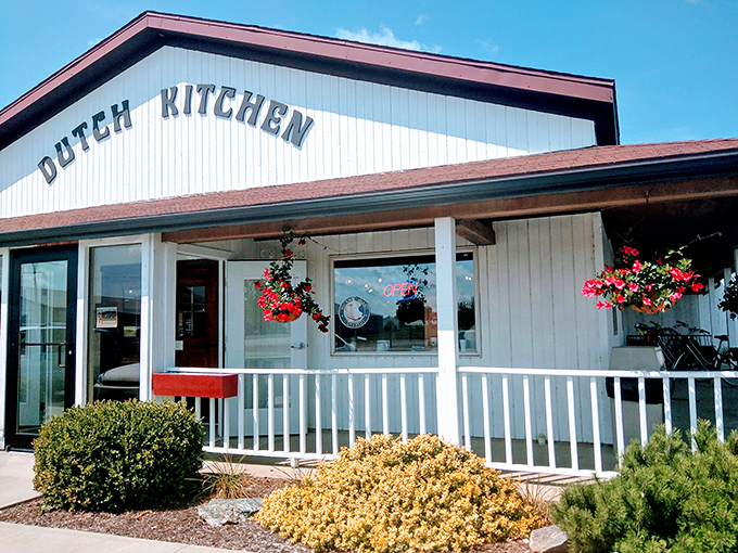 The unassuming white exterior of Dutch Kitchen welcomes hungry travelers like a lighthouse guiding ships to harbor—except this beacon promises pancakes instead of safety.