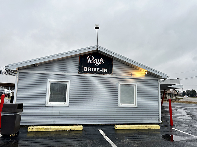 The iconic red pillars of Ray's Drive-In stand like sentinels guarding the promised land of tenderloin. Car hop service begins at 10 AM for those who prefer dining al fresco—in their Buick.
