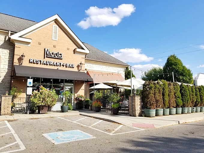The unassuming brick exterior of Nicola hides culinary treasures within—like finding a Lamborghini parked behind a garden shed.
