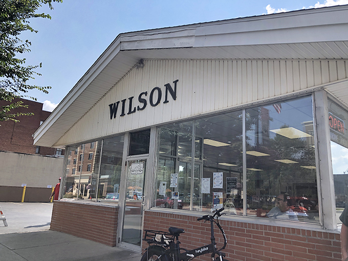 The corner storefront of Wilson's stands like a time capsule on Findlay's Main Street, beckoning hungry travelers with its vintage charm.