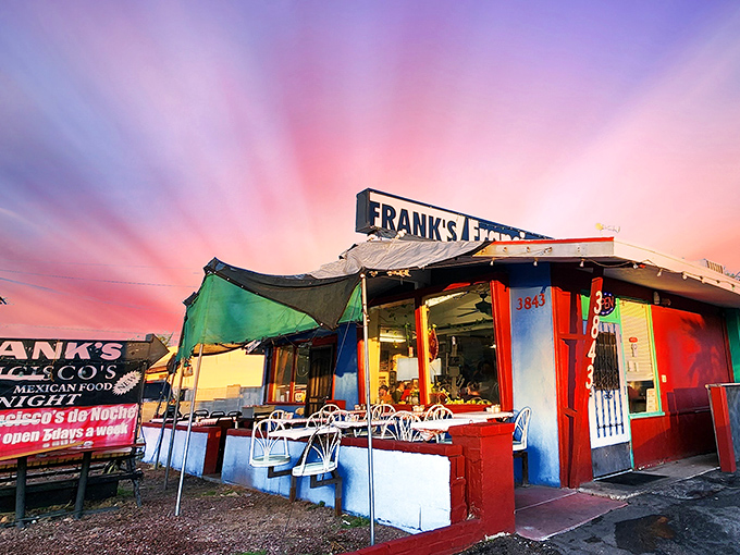 The unassuming blue exterior of Frank's Restaurant, where the sign promises good food and the patio delivers on Tucson's perfect weather.