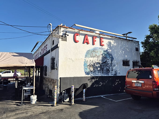 The iconic white building with red trim stands like a beacon of breakfast hope on Spring Street, promising morning salvation to hungry Angelenos.