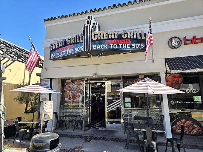 The neon sign beckons like a time portal, American flags standing guard at this Burbank treasure where nostalgia is always on the menu.