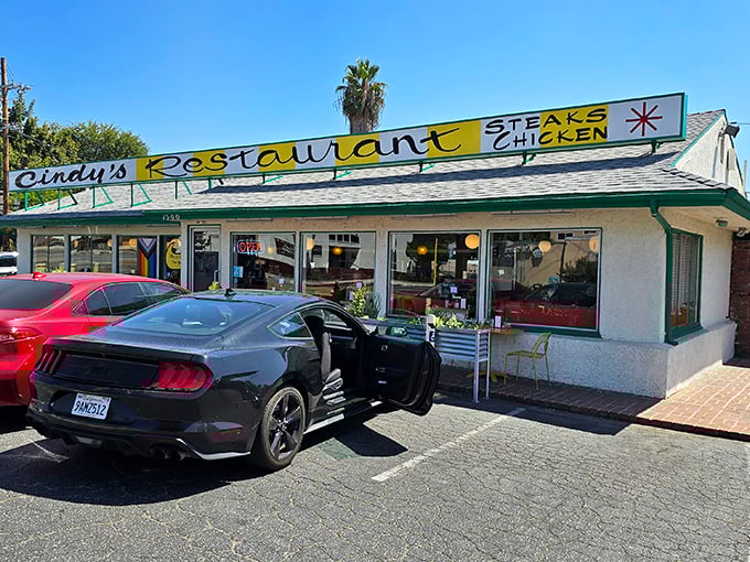The sunshine-yellow sign beckons like a time machine to simpler days, when comfort food wasn't ironic and calories didn't count on vacation.