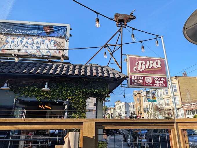 The charming exterior of 4505 Burgers & BBQ beckons with its vintage sign and vine-covered facade—a carnivore's oasis in San Francisco's urban landscape.