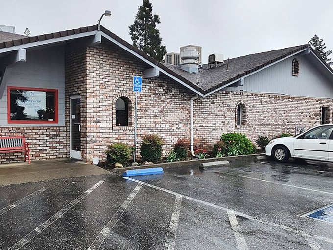 The stone facade and classic neon sign promise what every road trip deserves—a genuine diner experience where comfort trumps pretension.