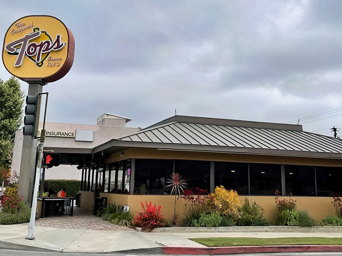 That iconic yellow sign has been beckoning hungry Pasadenans for decades – a beacon of burger bliss against the California sky.