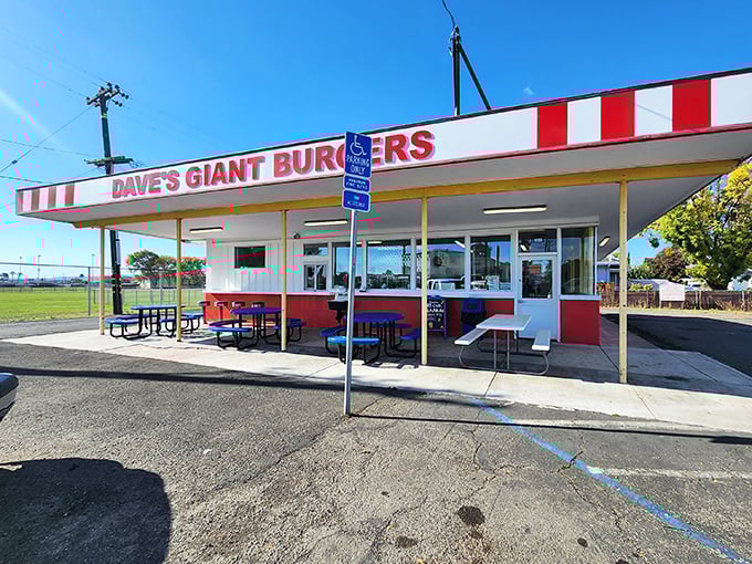 The red and white striped awning isn't just decoration—it's a beacon for burger lovers. Dave's Giant Hamburgers stands proudly in Fairfield, promising satisfaction without pretension.