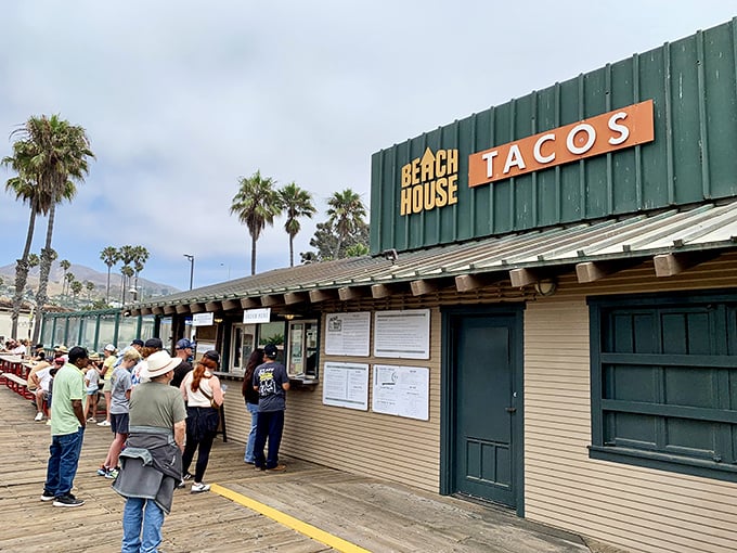 The green shack with the orange sign isn't trying to impress anyone—except your taste buds. California coastal dining at its most authentic.